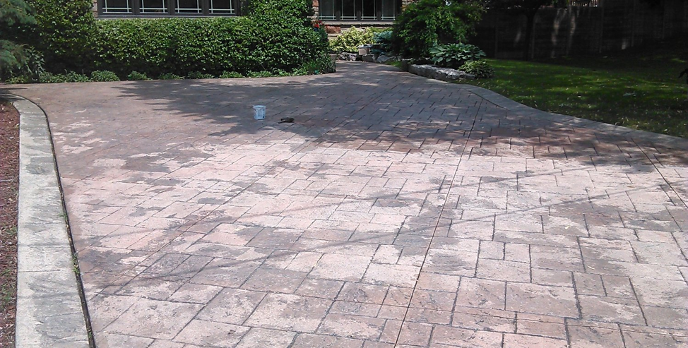 Breaking It Down: Comparing Stamped Concrete vs. Pavers & Slabs